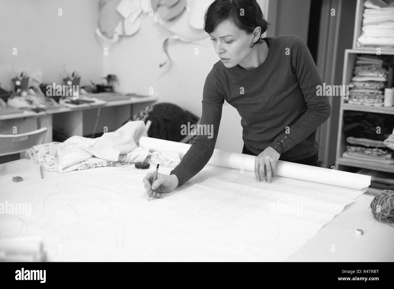 Young woman tailoring in her own small business crafting atelier Stock ...