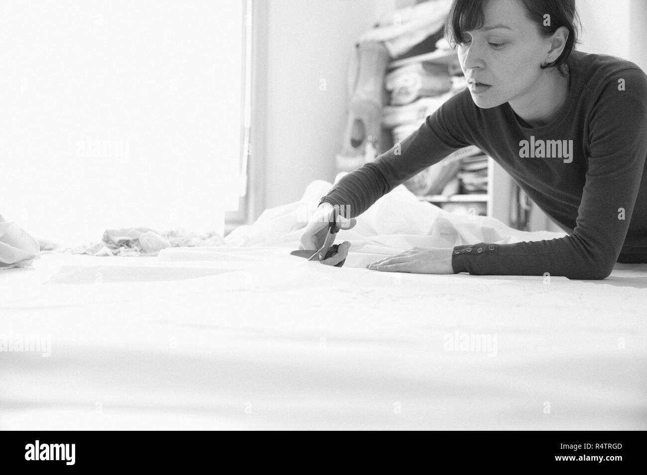 Young woman tailoring in her own small business crafting atelier Stock ...