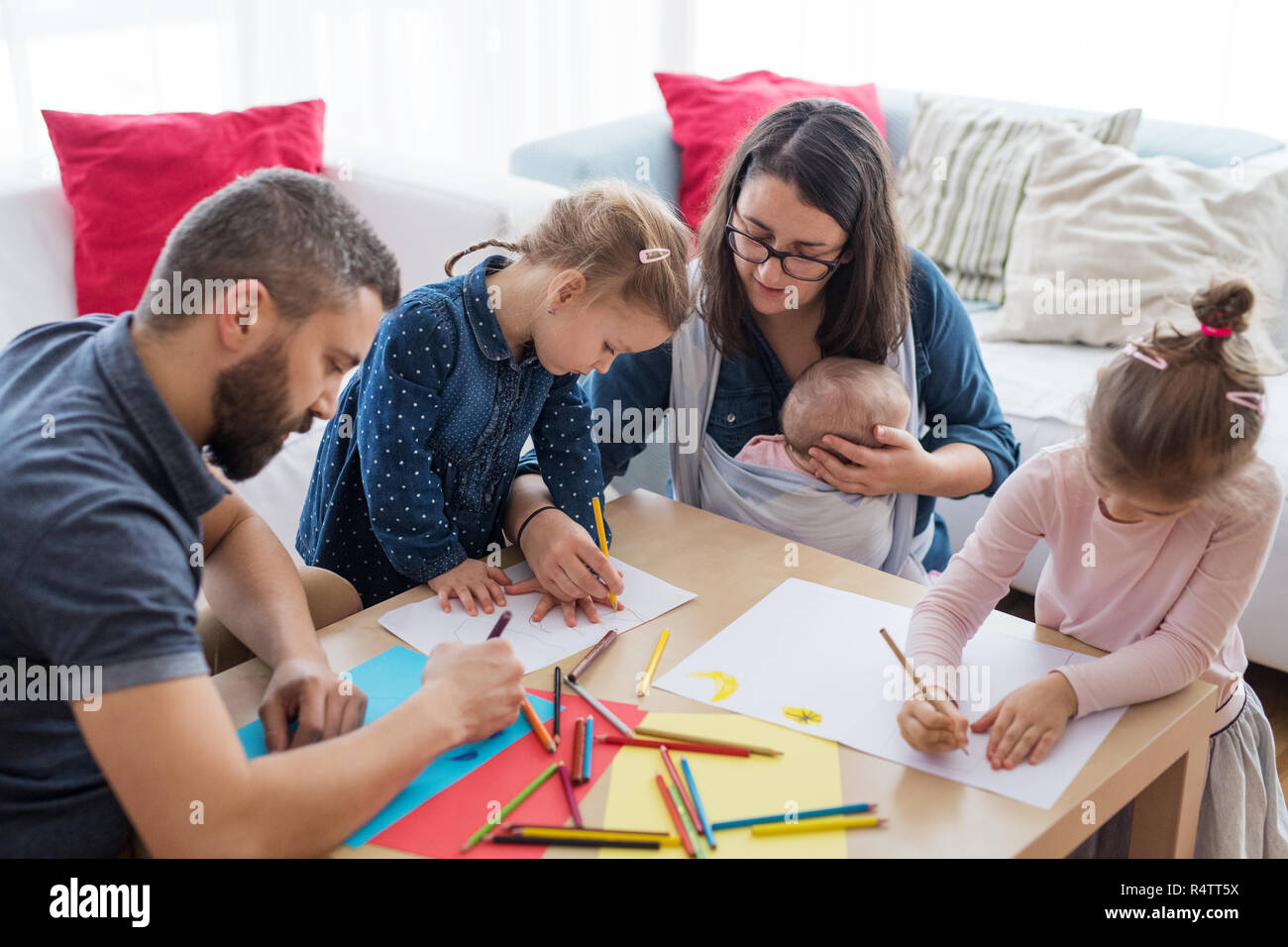 Family kids sitting around table hi-res stock photography and images ...