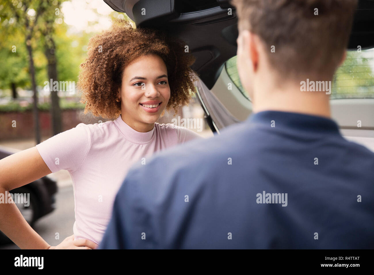 Young couple talking car city hi-res stock photography and images - Alamy