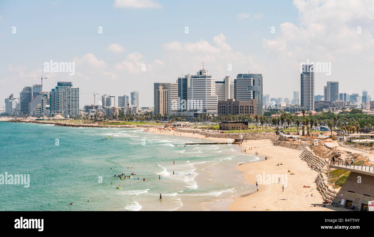 People on the beach, Alma Beach, view of skyline of Tel Aviv with ...