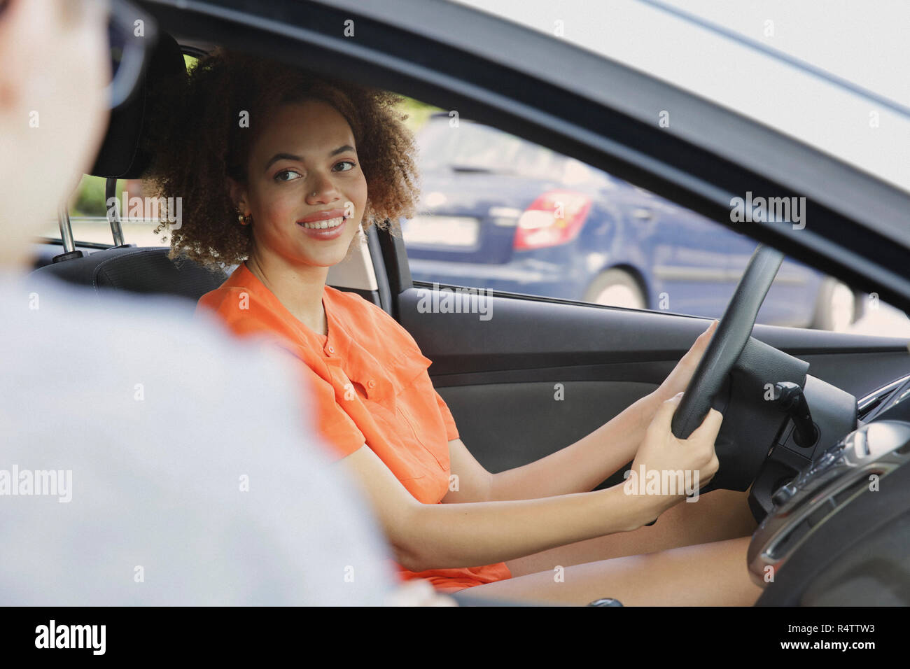Young woman driving car Stock Photo - Alamy