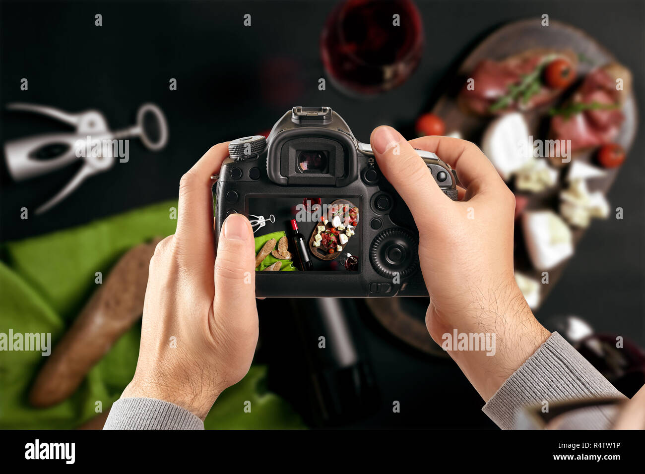 Digital single-lens reflex camera in hands. Photographer shooting hands ...