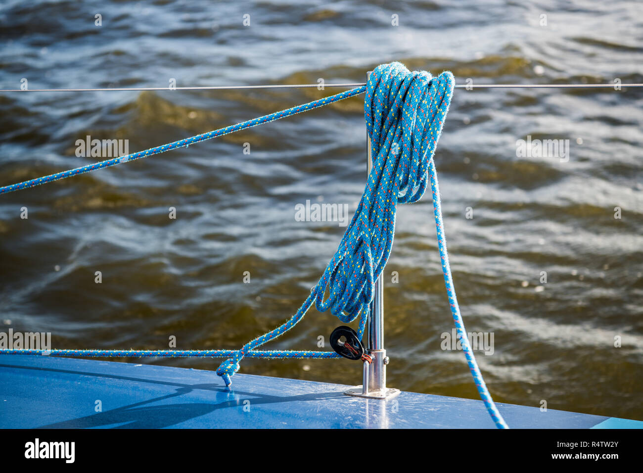 The rigging block with swivel and yellow rope. Part of the rigging of ...
