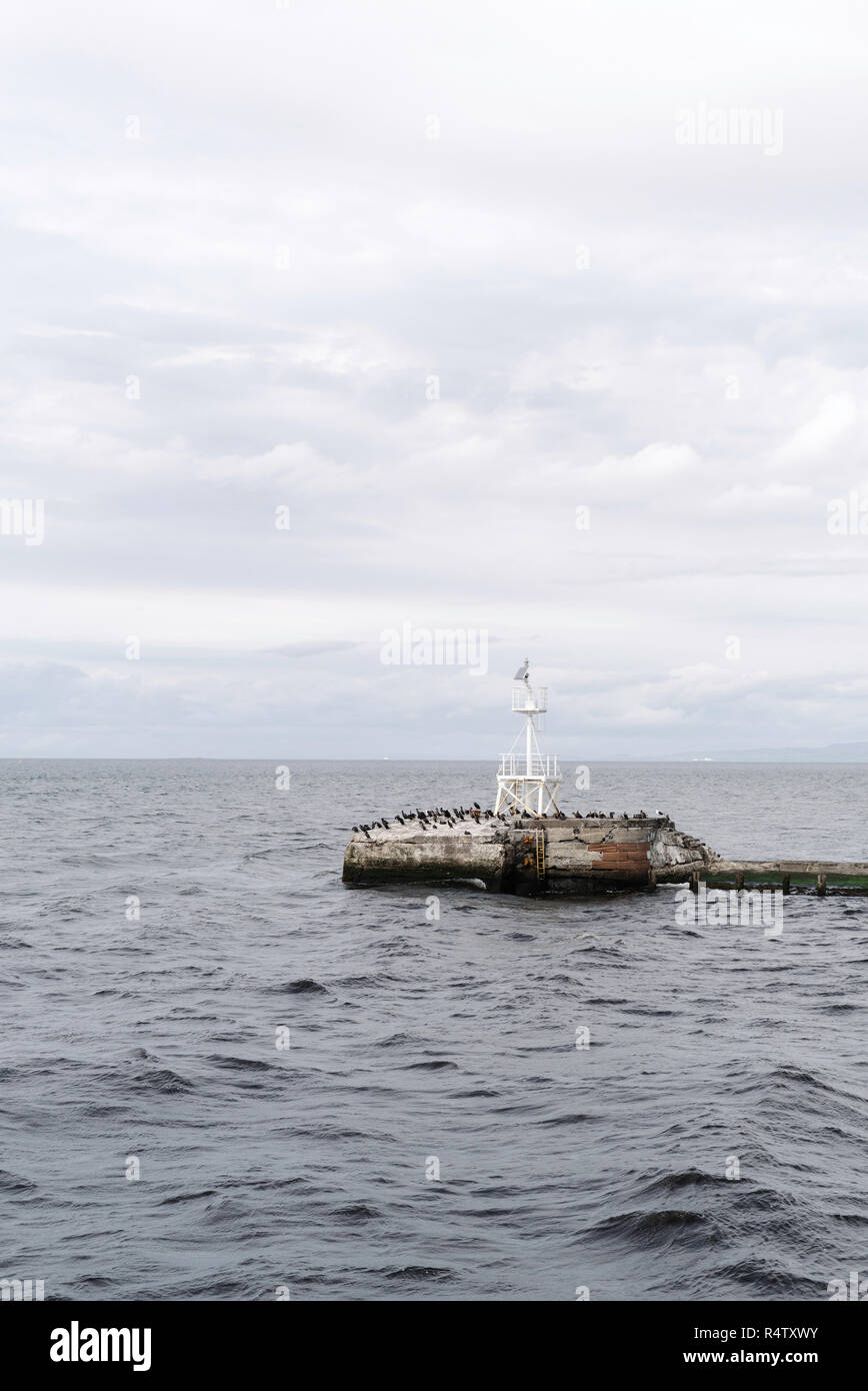 Solar powered light station at the entrance to Ayr Harbour, Scotland ...