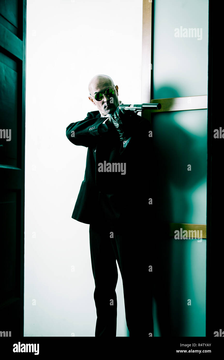 Armed secret agent Stock Photo - Alamy
