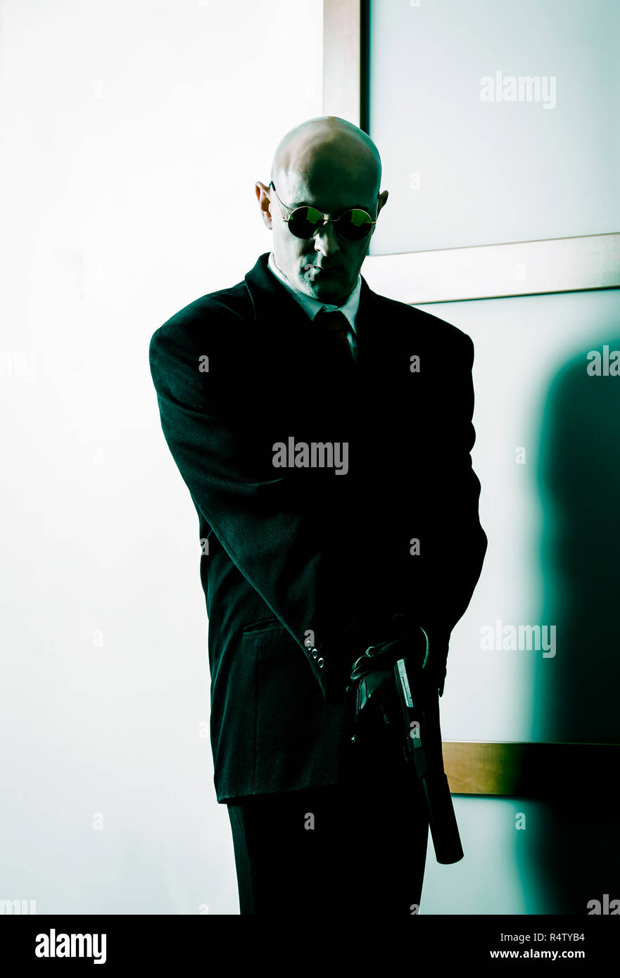 Armed secret agent Stock Photo - Alamy