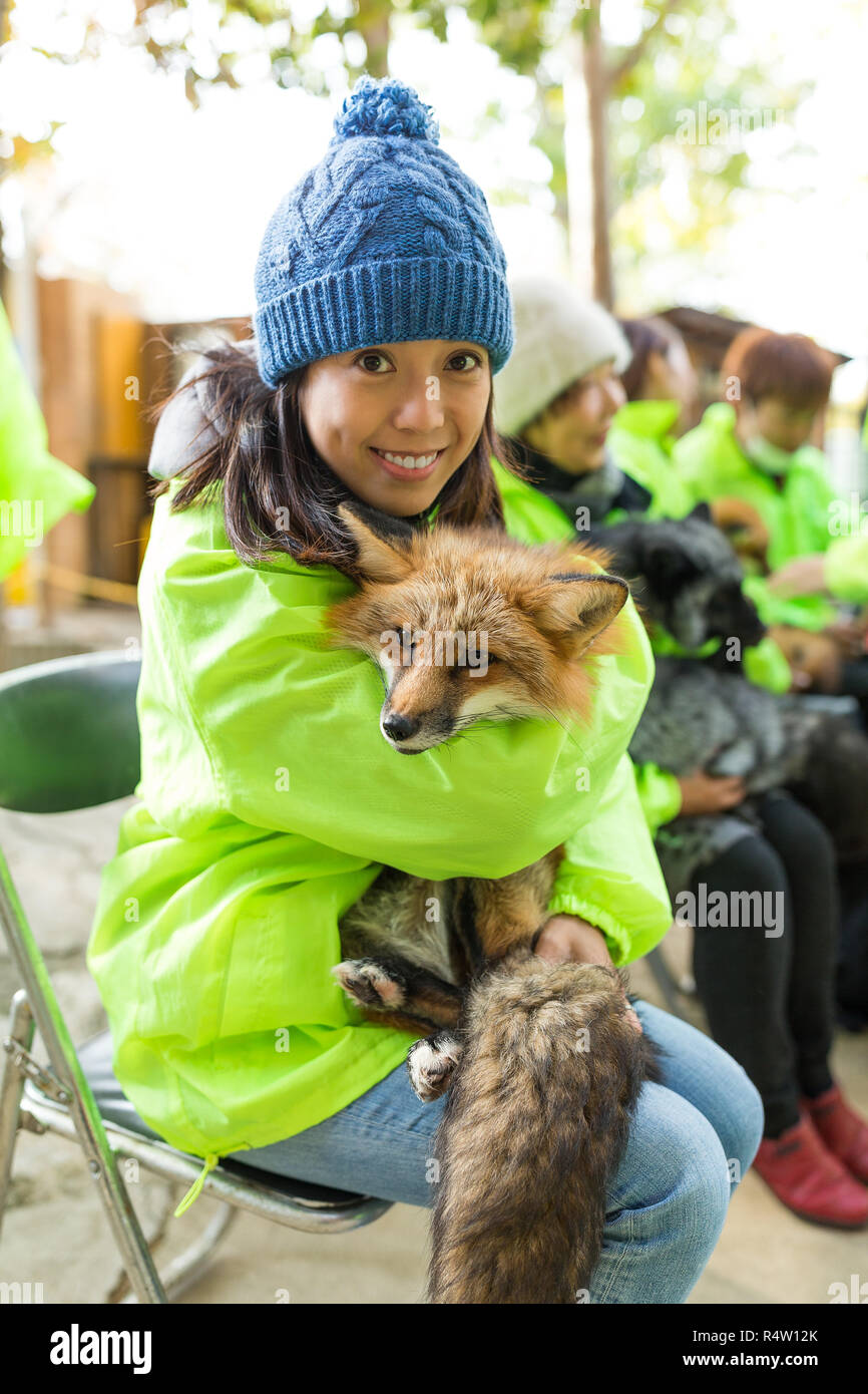 Woman hug fox Stock Photo - Alamy