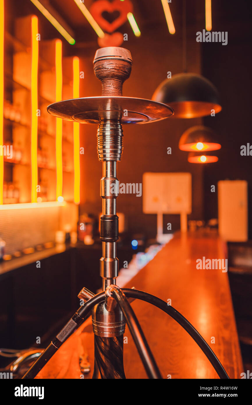 Wood hookah on table in hookah lounge Stock Photo - Alamy