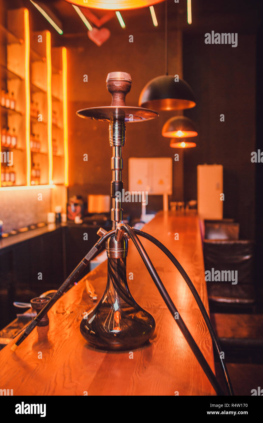 Wood hookah on table in hookah lounge Stock Photo - Alamy