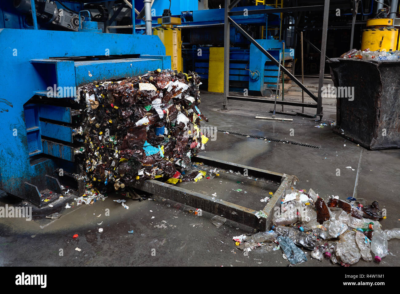Modern waste sorting and recycling plant, hydraulic press makes wired ...