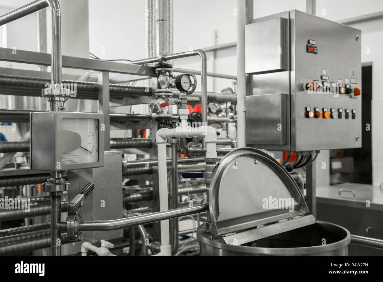 electronic control panel and tank at a milk factory. equipment at the ...