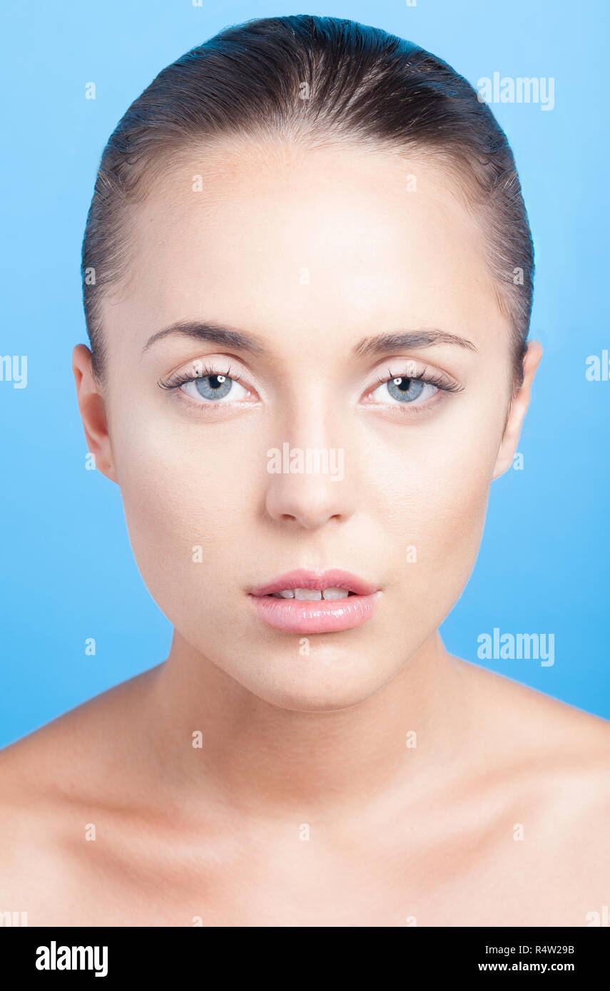 Portrait of a young woman looking at the lens Stock Photo - Alamy