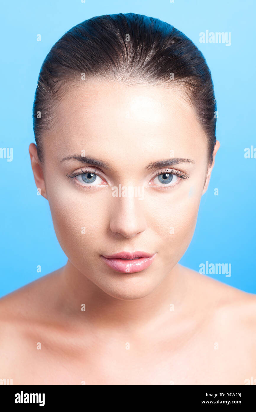 Portrait of a young woman looking at the lens Stock Photo - Alamy