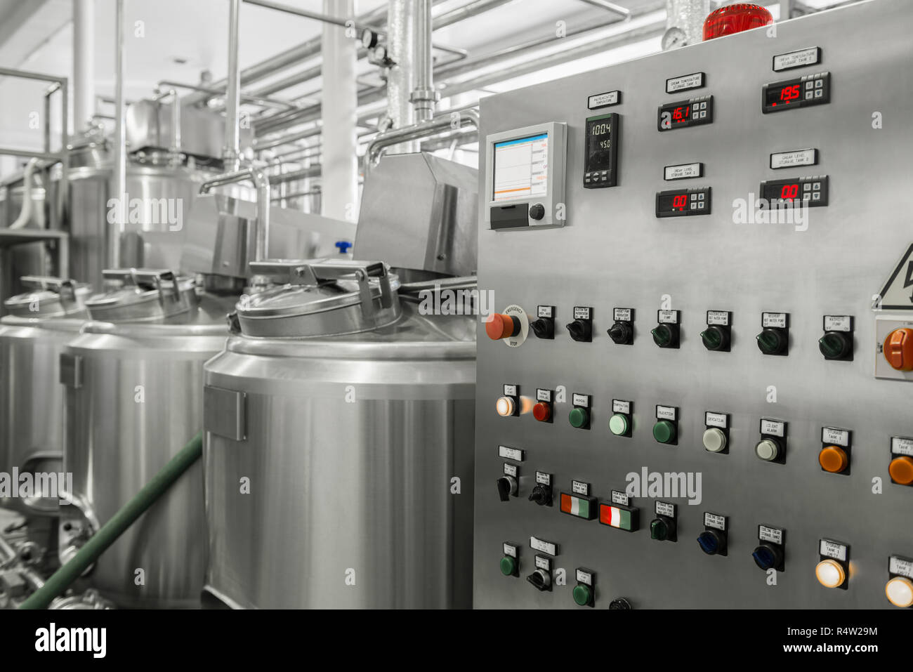 electronic control panel and tank at a milk factory. equipment at the ...