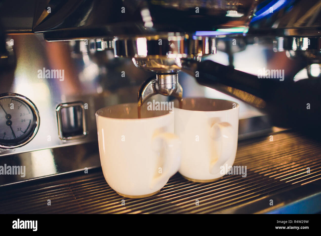 Professional coffee machine making espresso in a cafe Stock Photo - Alamy