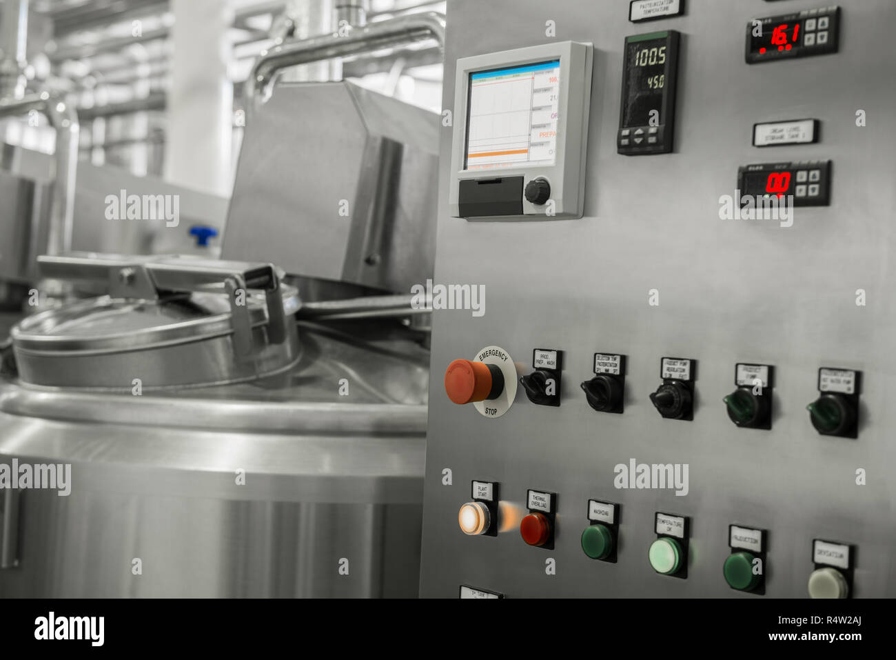 electronic control panel and tank at a milk factory. equipment at the ...