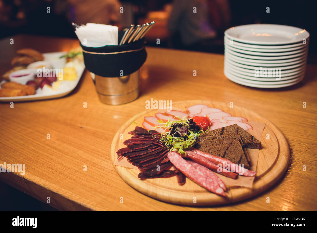 wooden tray with three types of cold cuts Stock Photo - Alamy