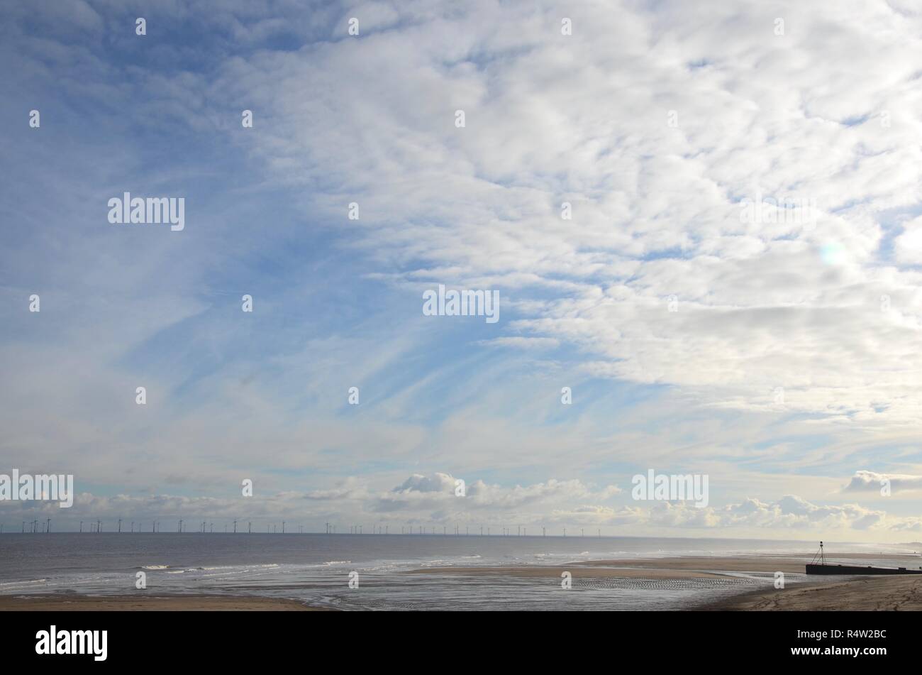 Empty seascape with big open sky, clouds and wind turbines on the ...