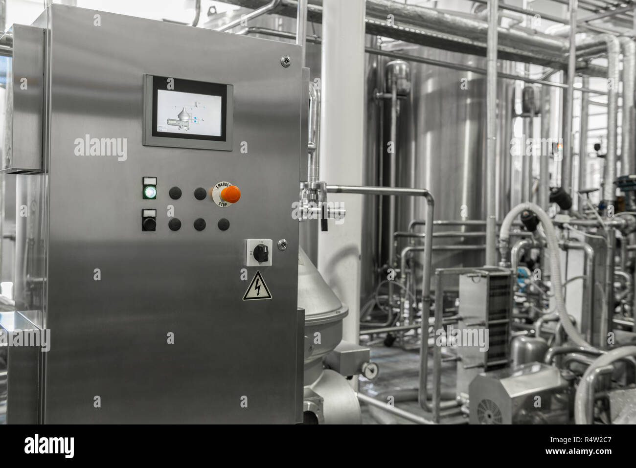 electronic control panel and tank at a milk factory. equipment at the ...