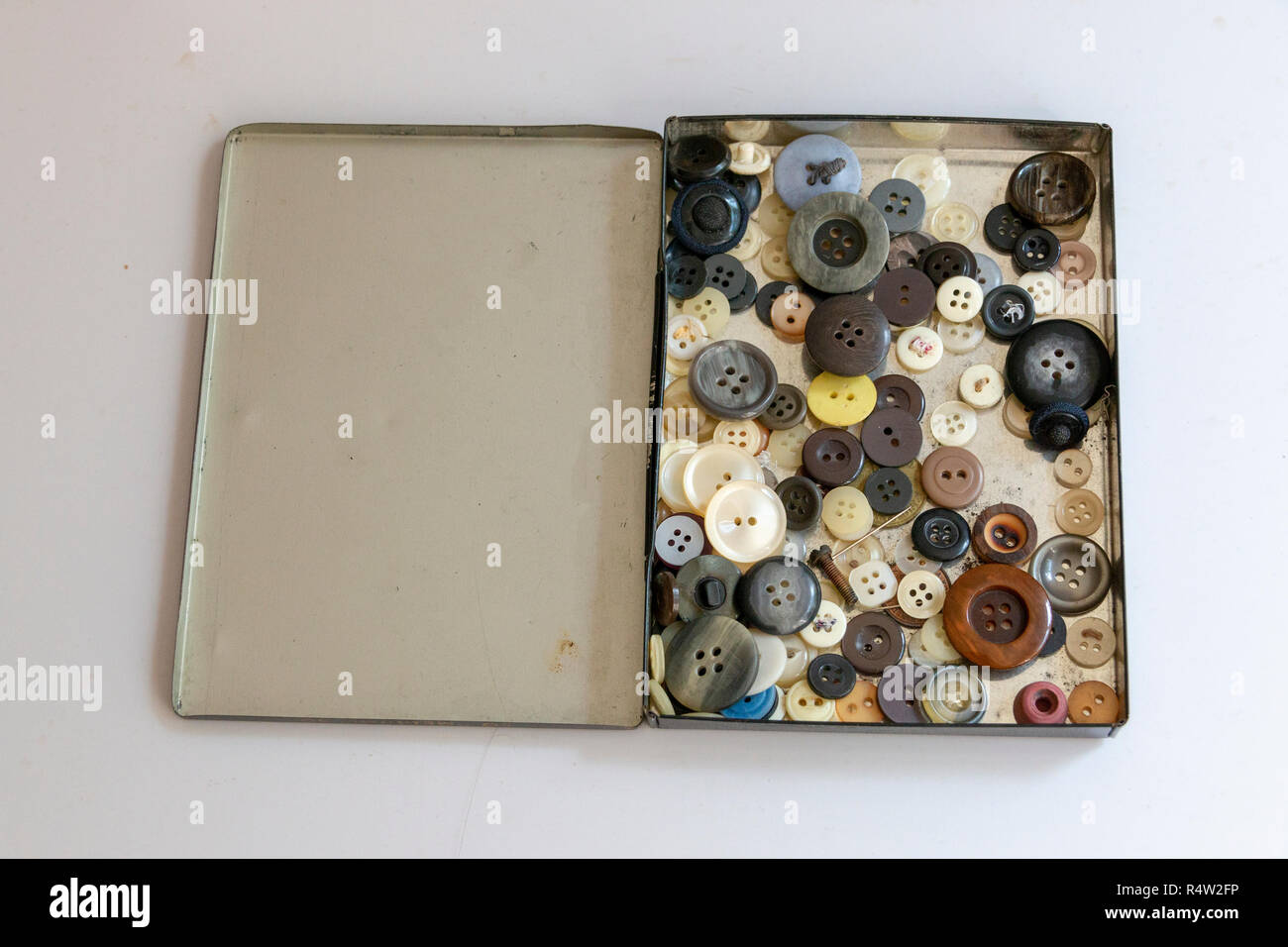 A close up view of a old metal box with differnt size and colour ...