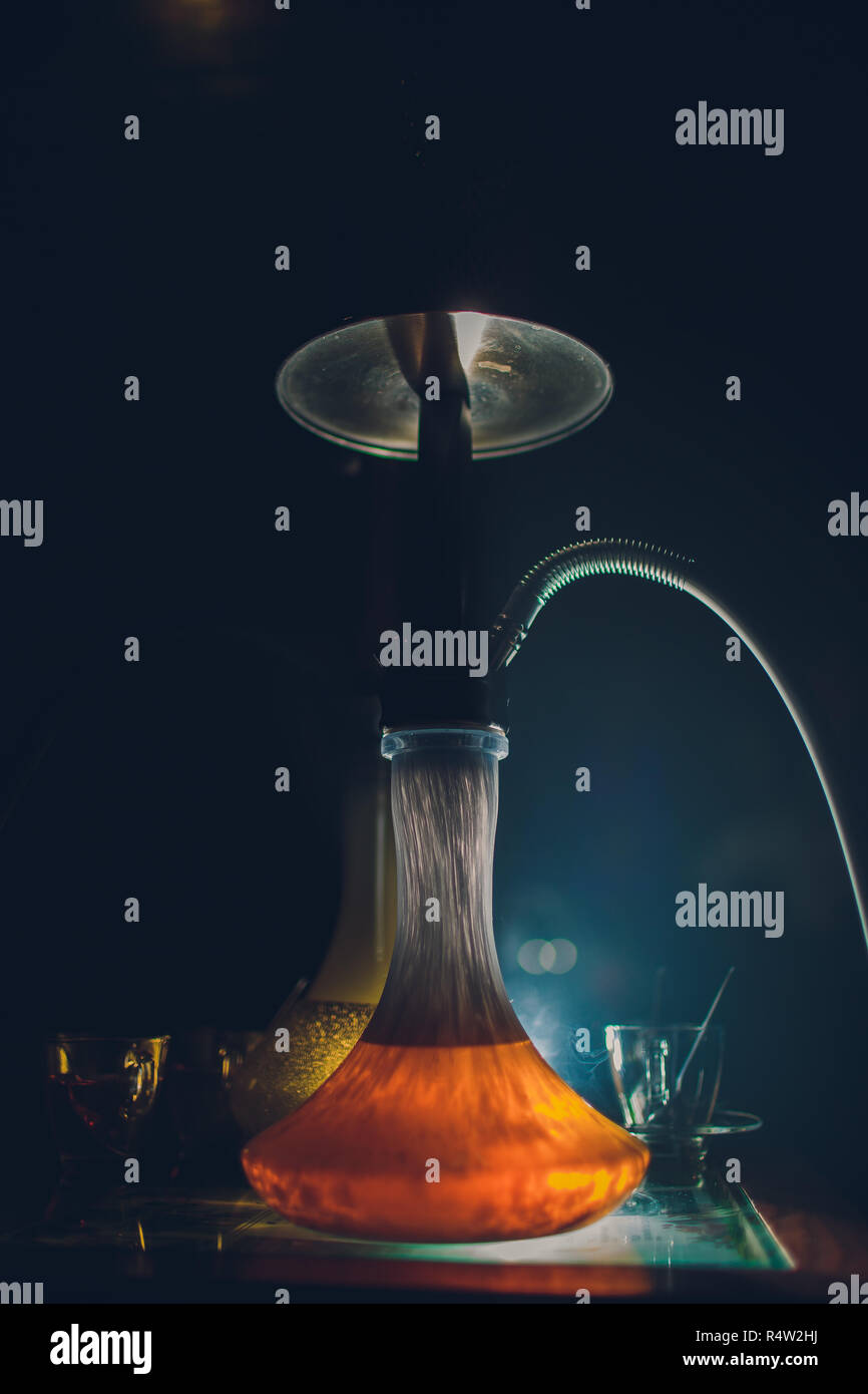 Hookah hot coals on shisha bowl with black background. Stylish oriental ...