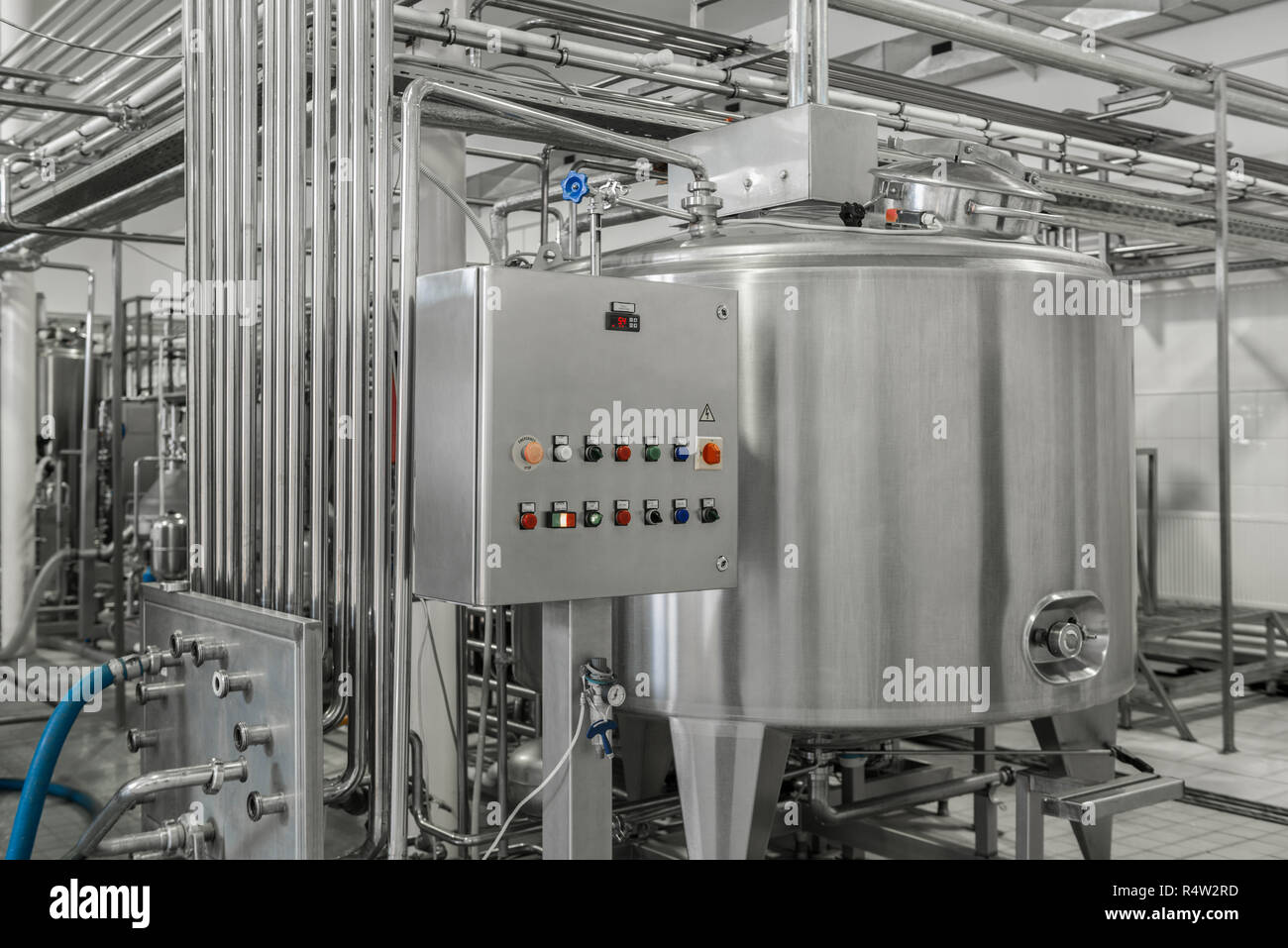 electronic control panel and tank at a milk factory. equipment at the ...