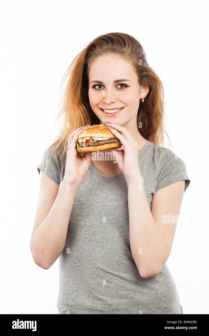 Cute girl holding a hamburger Stock Photo - Alamy