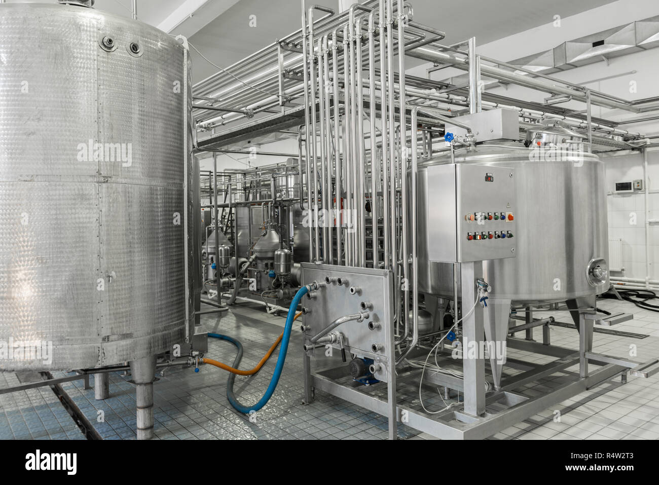 electronic control panel and tank at a milk factory. equipment at the ...
