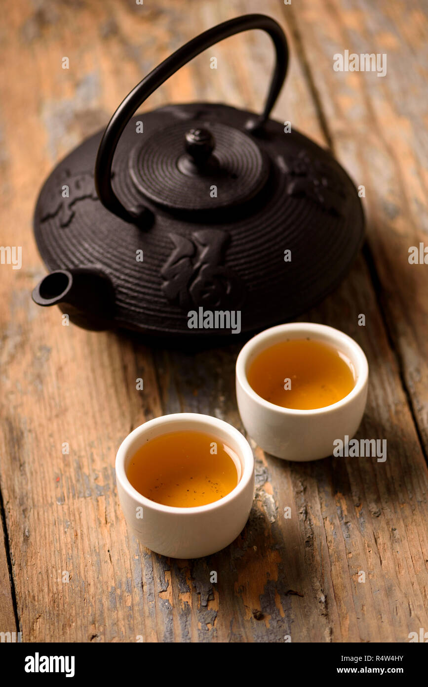 Traditional japanese herbal tea recipe prepared in cast iron teapot ...