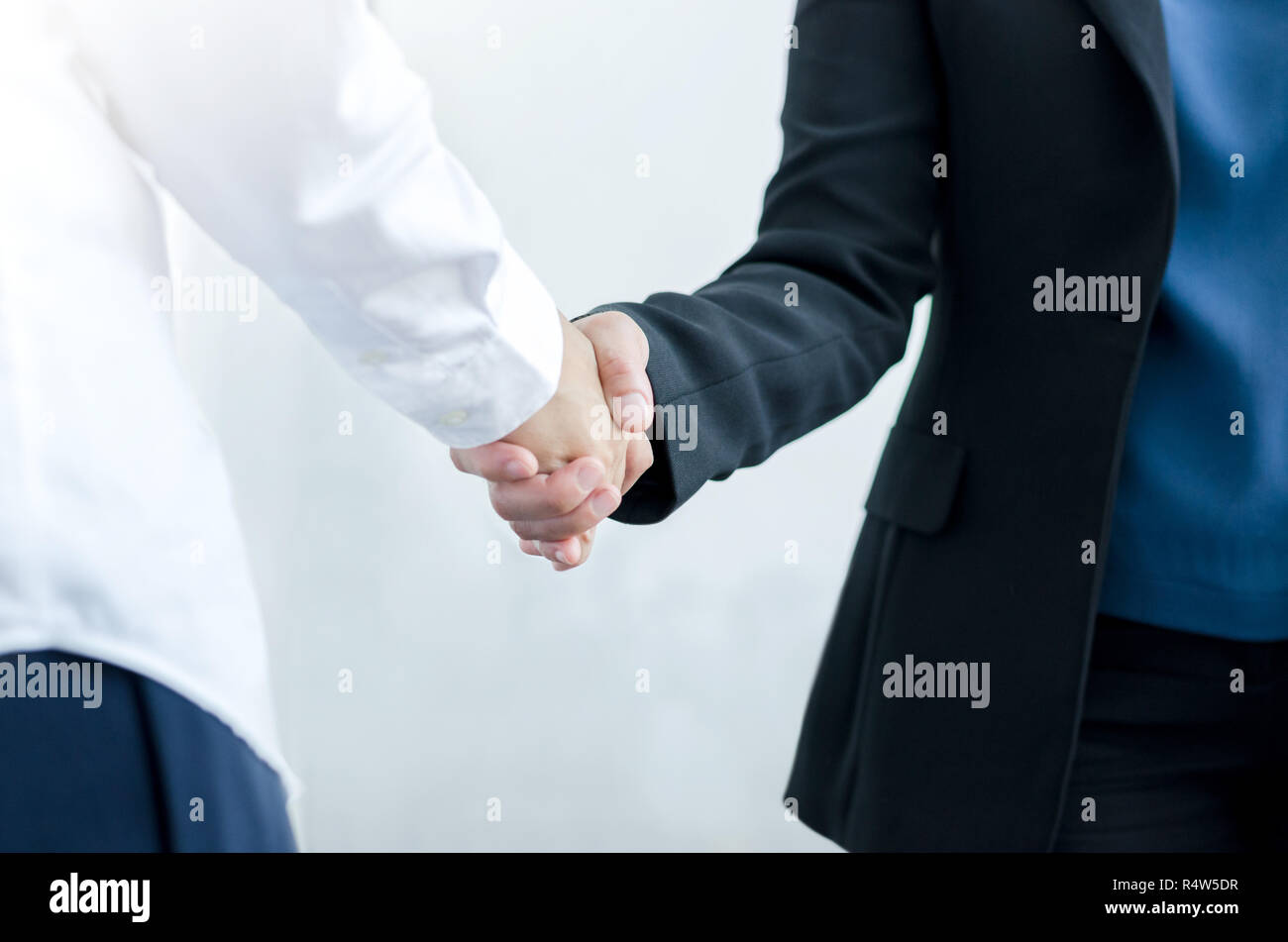 Business people shaking hands, finishing up a meeting Stock Photo - Alamy