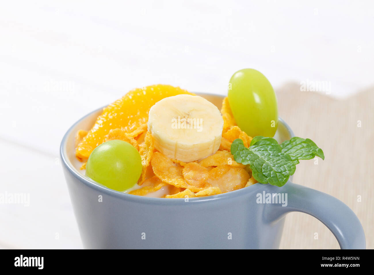 corn flakes with milk and fresh fruit Stock Photo - Alamy