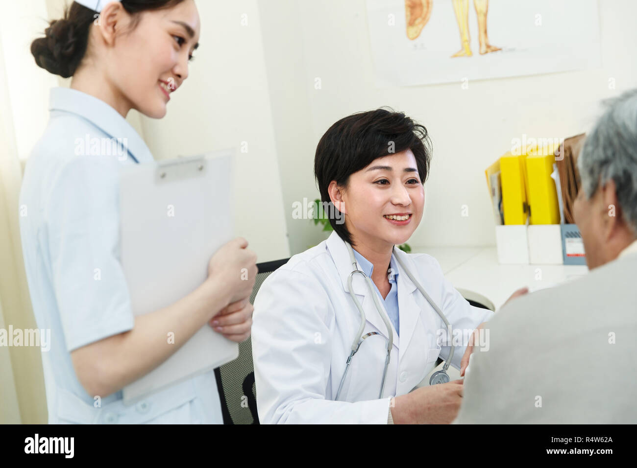 Medical workers and patients in the doctor's office Stock Photo - Alamy
