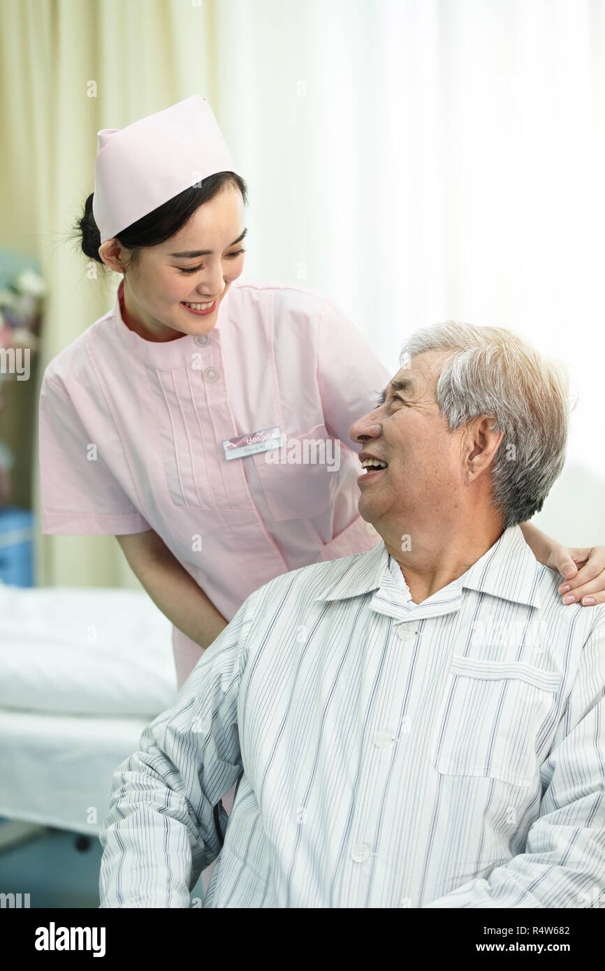 Nurses and patients in the ward Stock Photo - Alamy