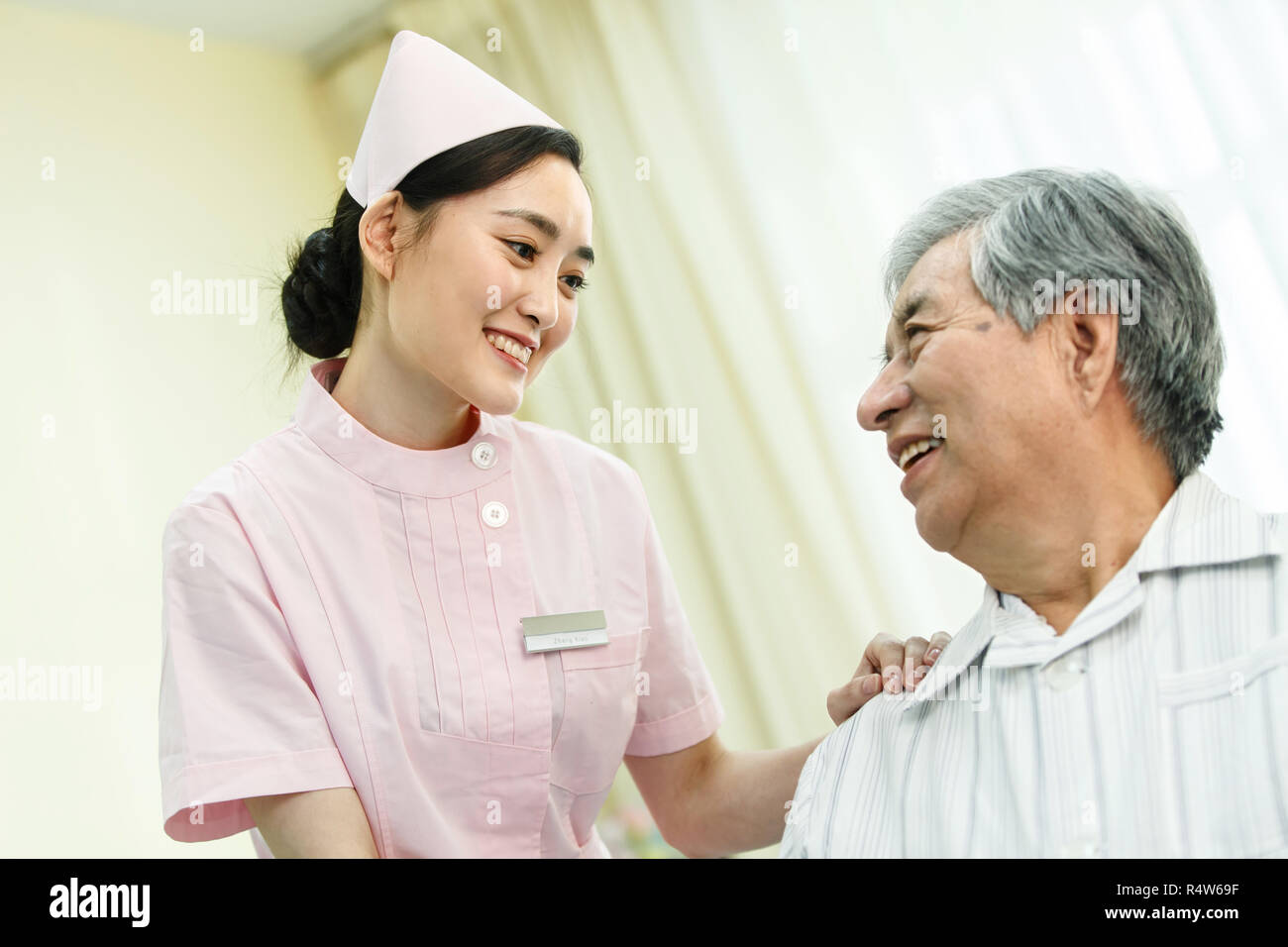 Nurses and patients in the ward Stock Photo - Alamy