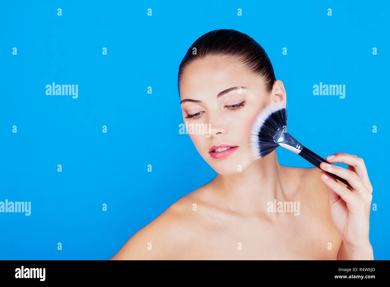 Woman using body brush hi-res stock photography and images - Alamy