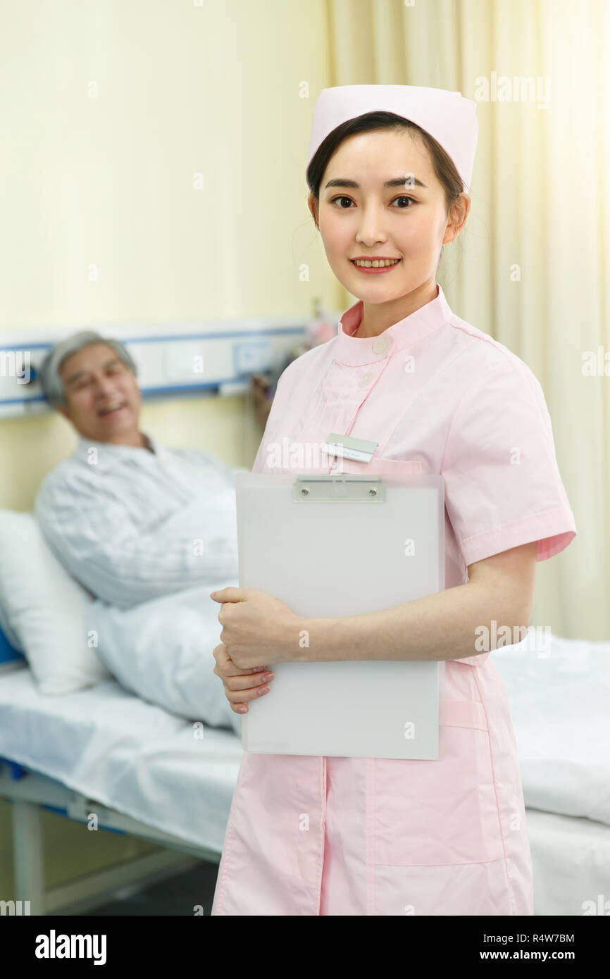 Nurses and patients in the ward Stock Photo - Alamy
