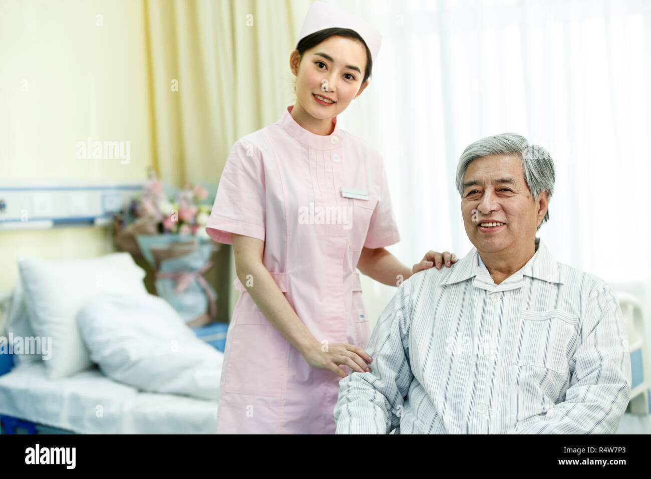 Nurses and patients in the ward Stock Photo - Alamy