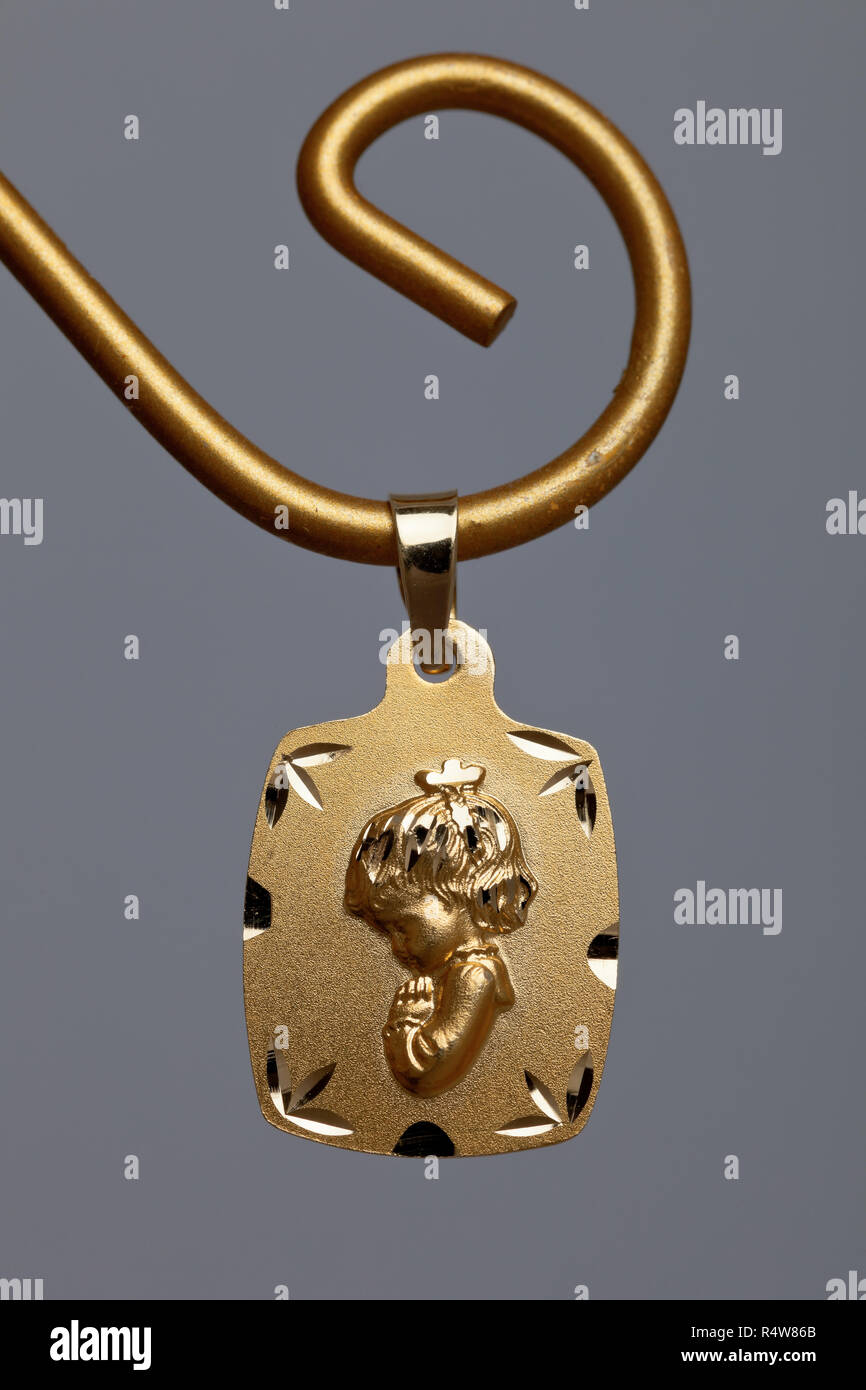 Baby gold chain hi-res stock photography and images - Alamy