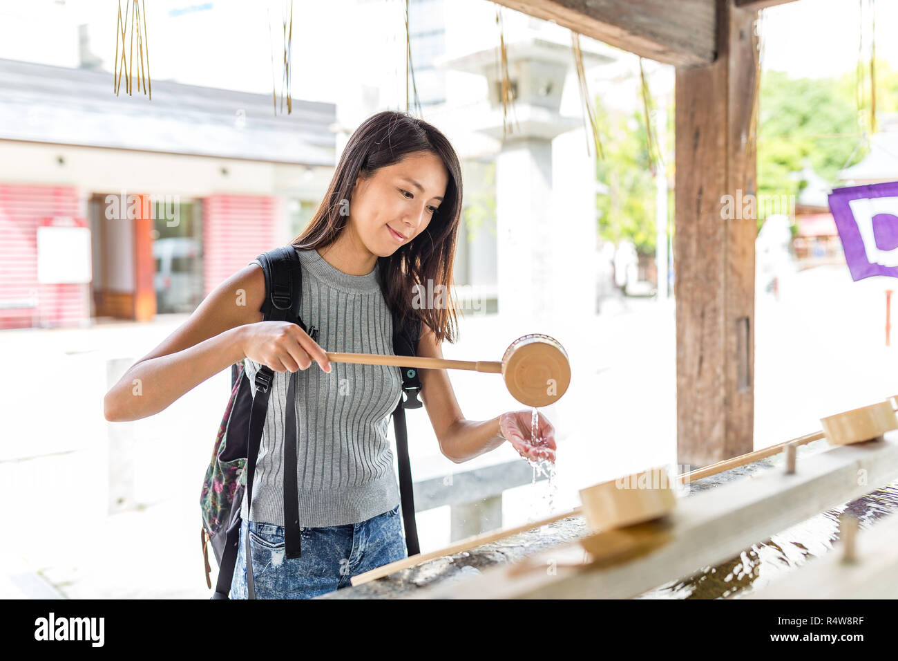 Woman washing hand in japanese temple Stock Photo - Alamy