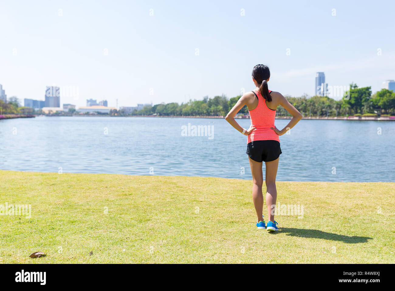 Back view of sport woman at park in sunshine Stock Photo - Alamy