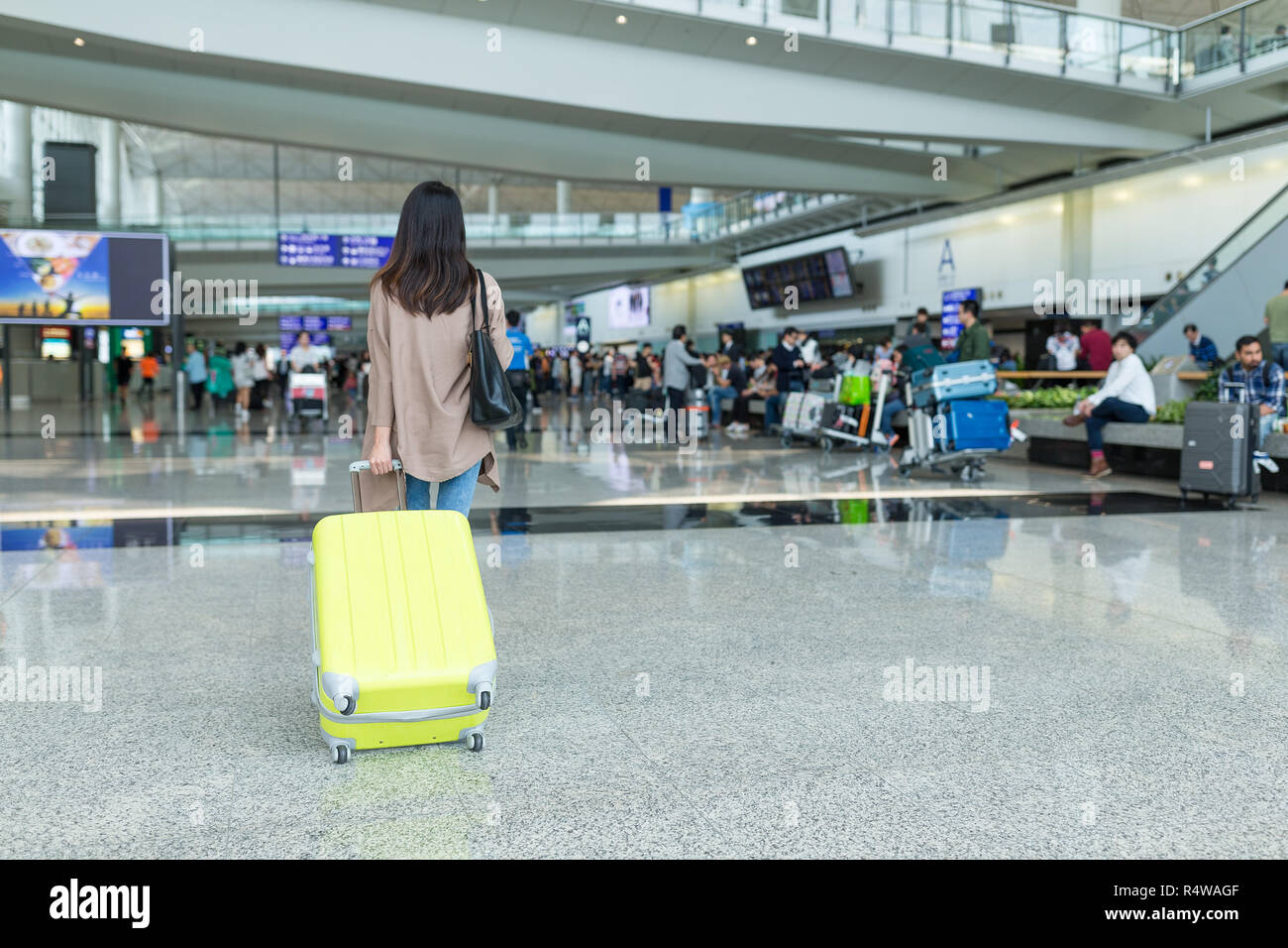 Back rear view of woman in Hong Kong airport Stock Photo - Alamy