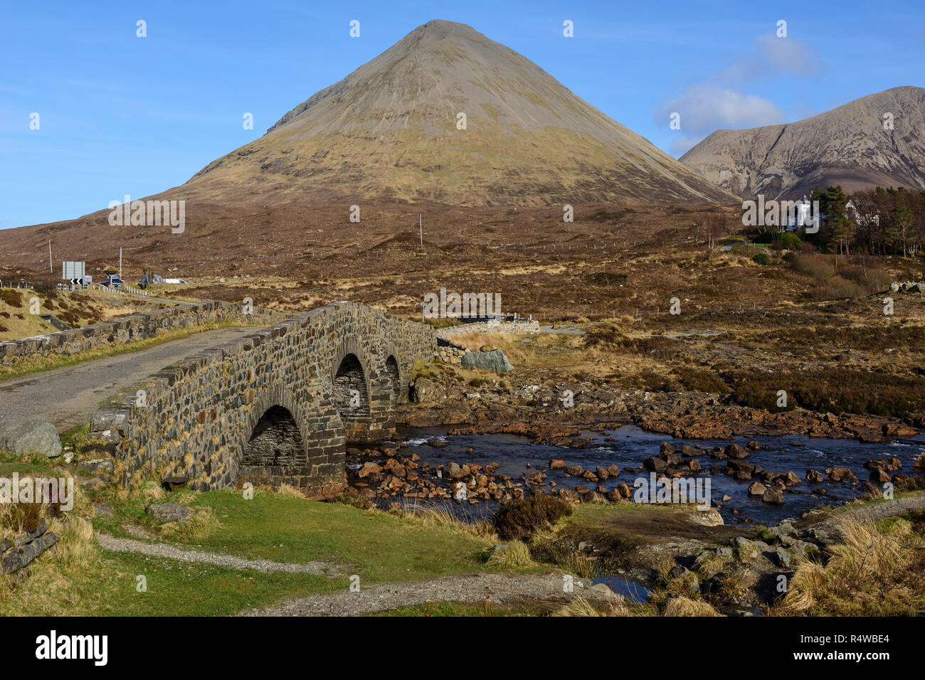The old stone bridge over the Sligachan River with a backdrop of the ...