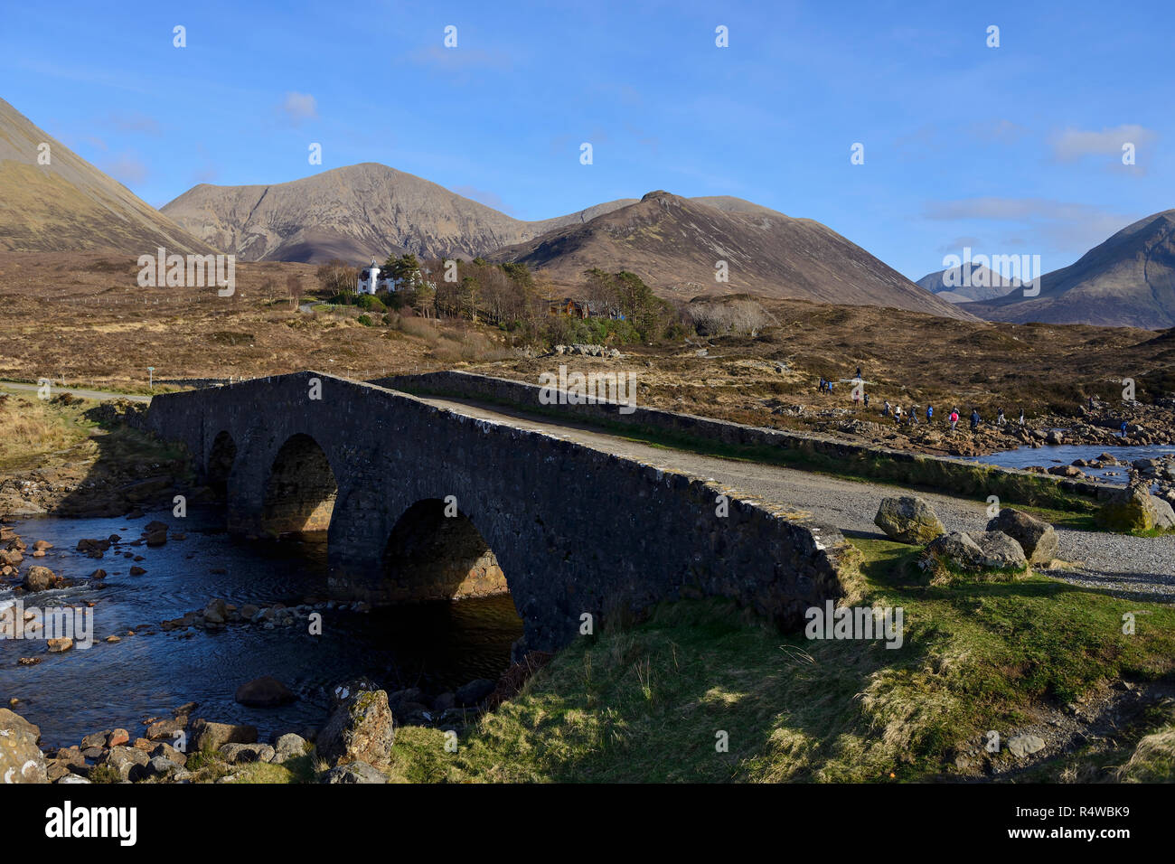 The old stone bridge over the Sligachan River with a backdrop of the ...