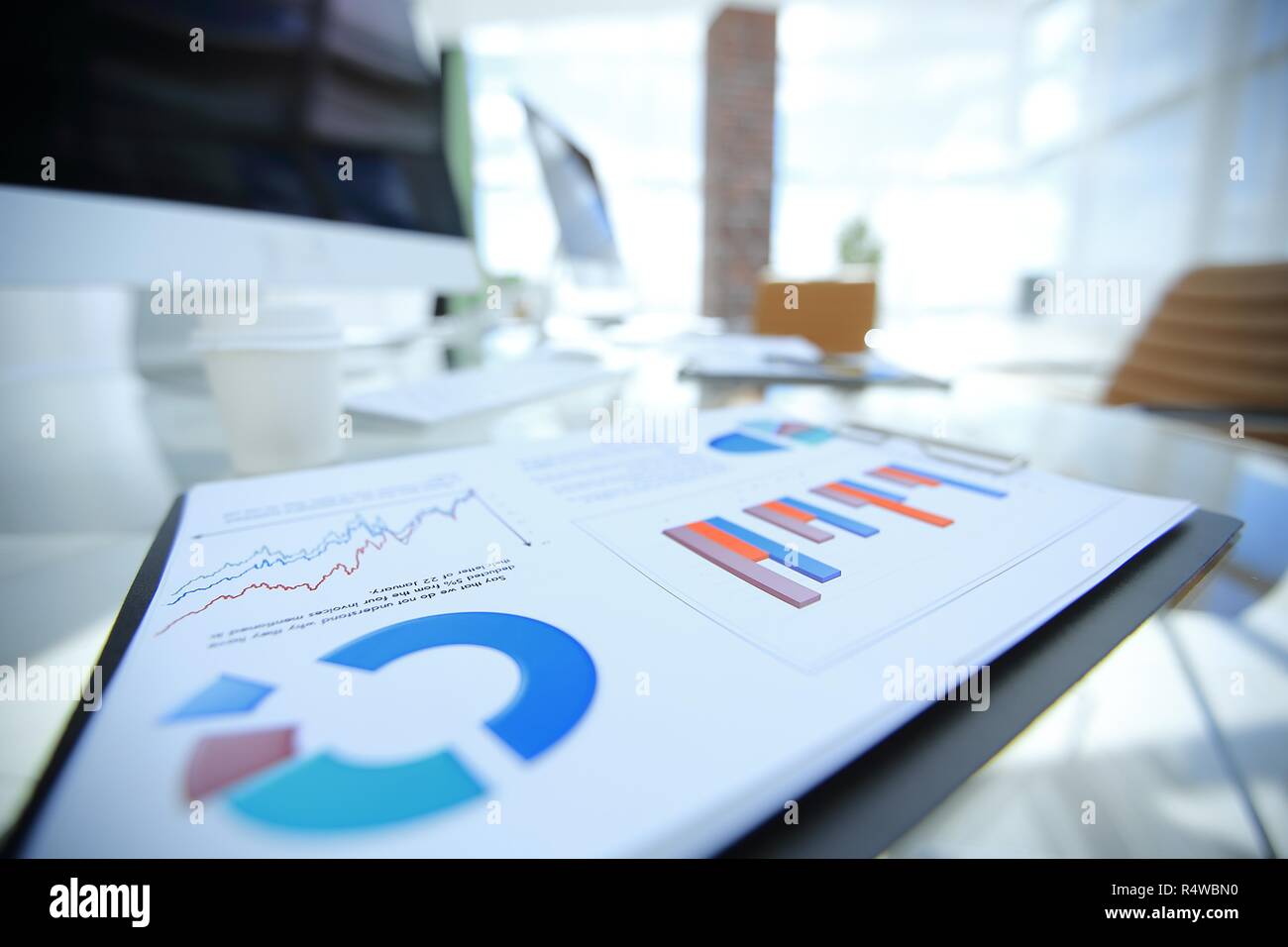 closeup.financial chart on the table from a businessman Stock Photo - Alamy