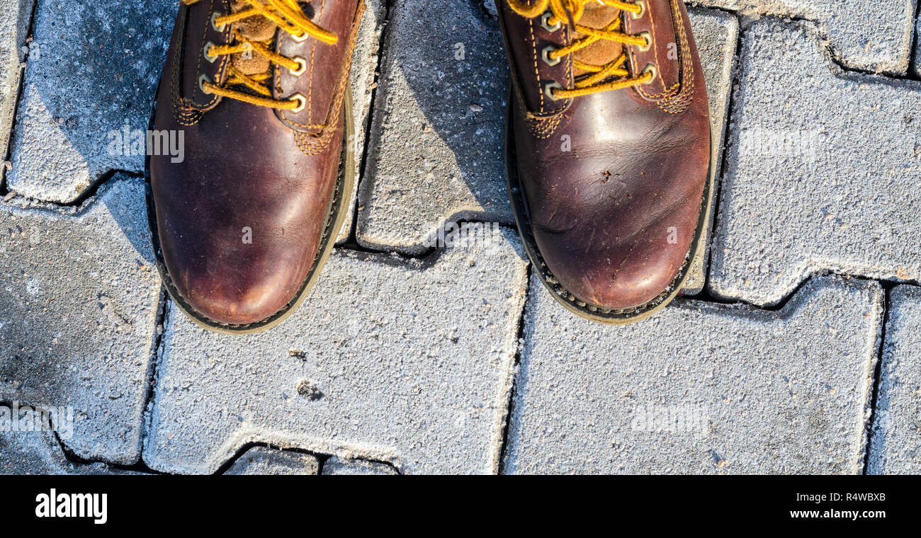 First person view of shoes. Winter walk concept. View from above on ...