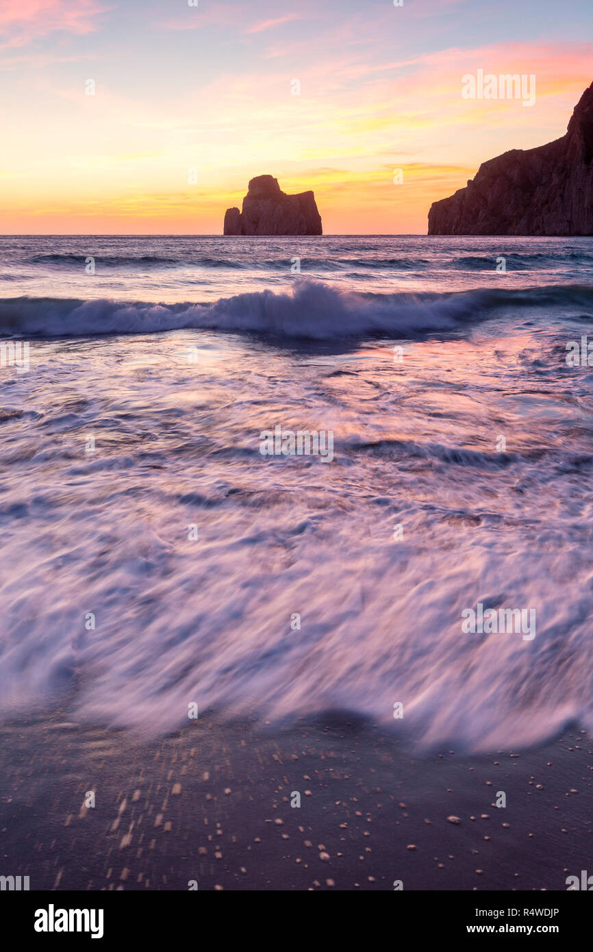 Waves at sunset on the Beach of Masua, Iglesias, Sud Sardegna province ...
