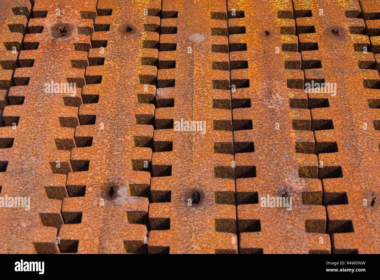 A stack of rust stained replacement firebox gratings behind the engine ...