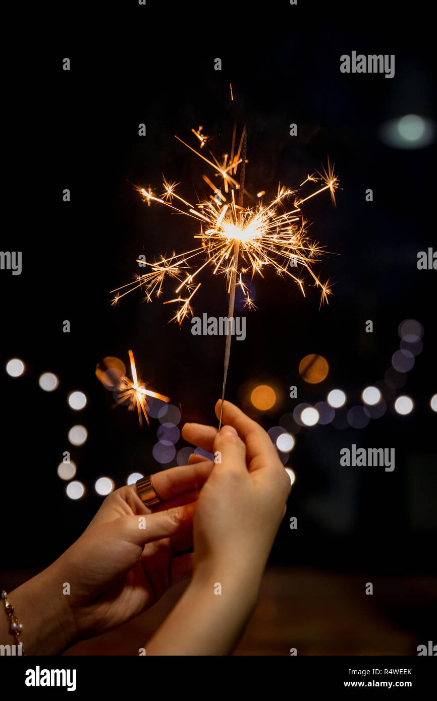 Holding the fireworks Stock Photo - Alamy