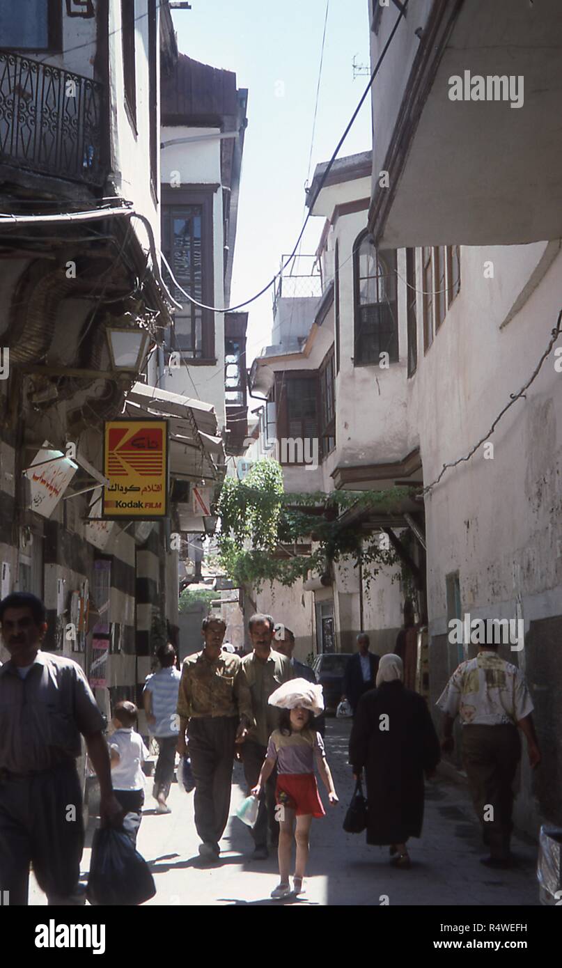 Scene of a crowded balcony-lined alleyway in Damascus, Syria, June 1994 ...